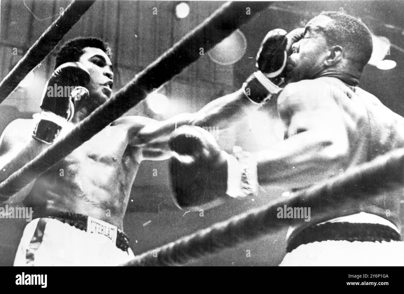 The New World Heavyweight Champion Cassius Clay lands a left on the eye ...