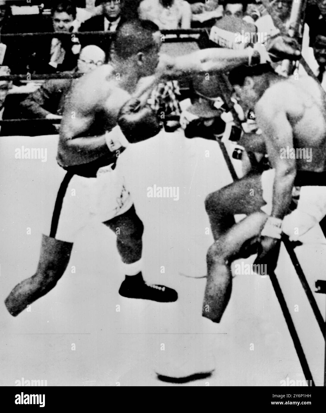 The New World Heavyweight Champion Cassius Clay ducks to to avoid a ...