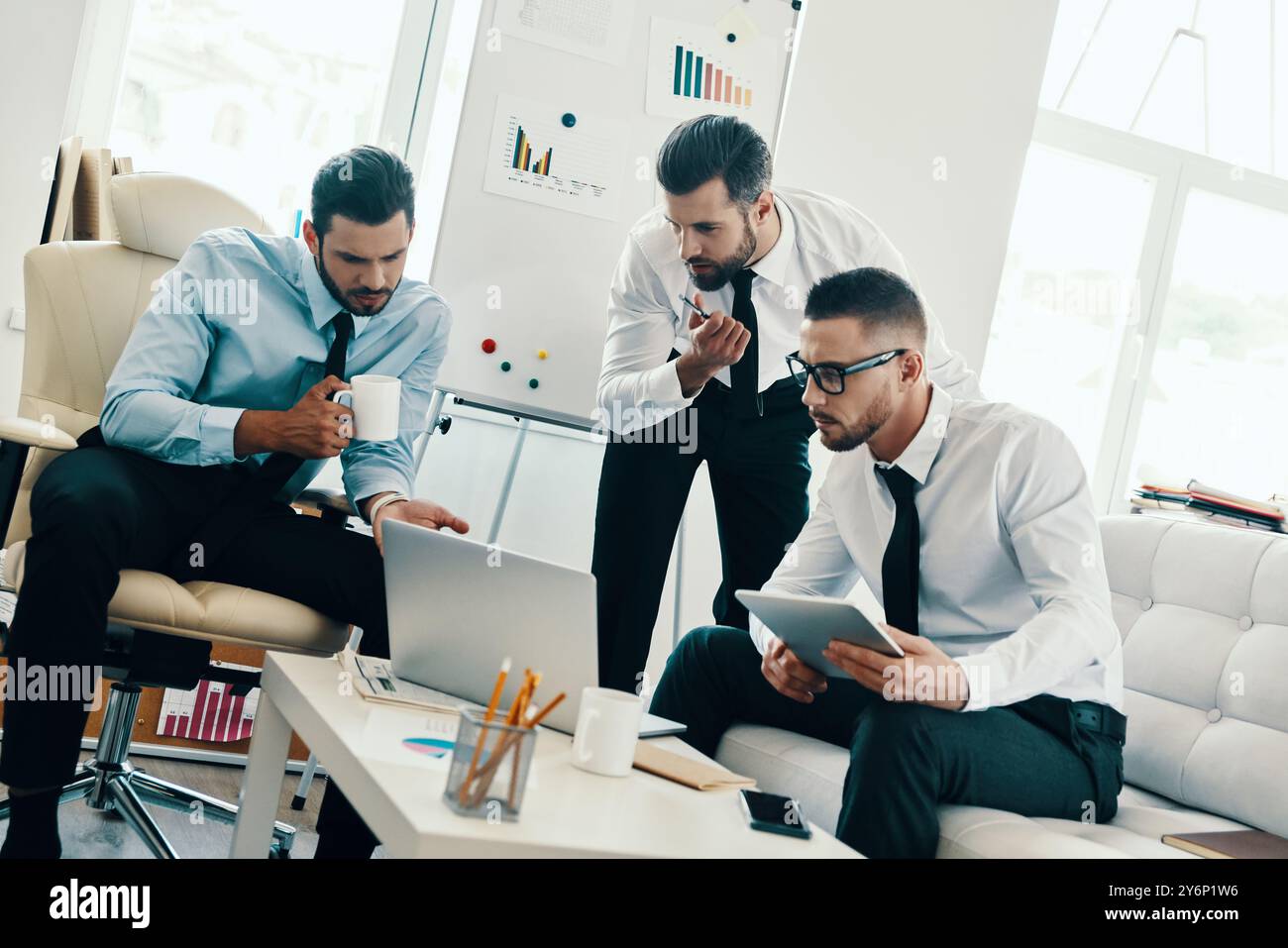 Successful business team. Group of young modern men in formalwear ...