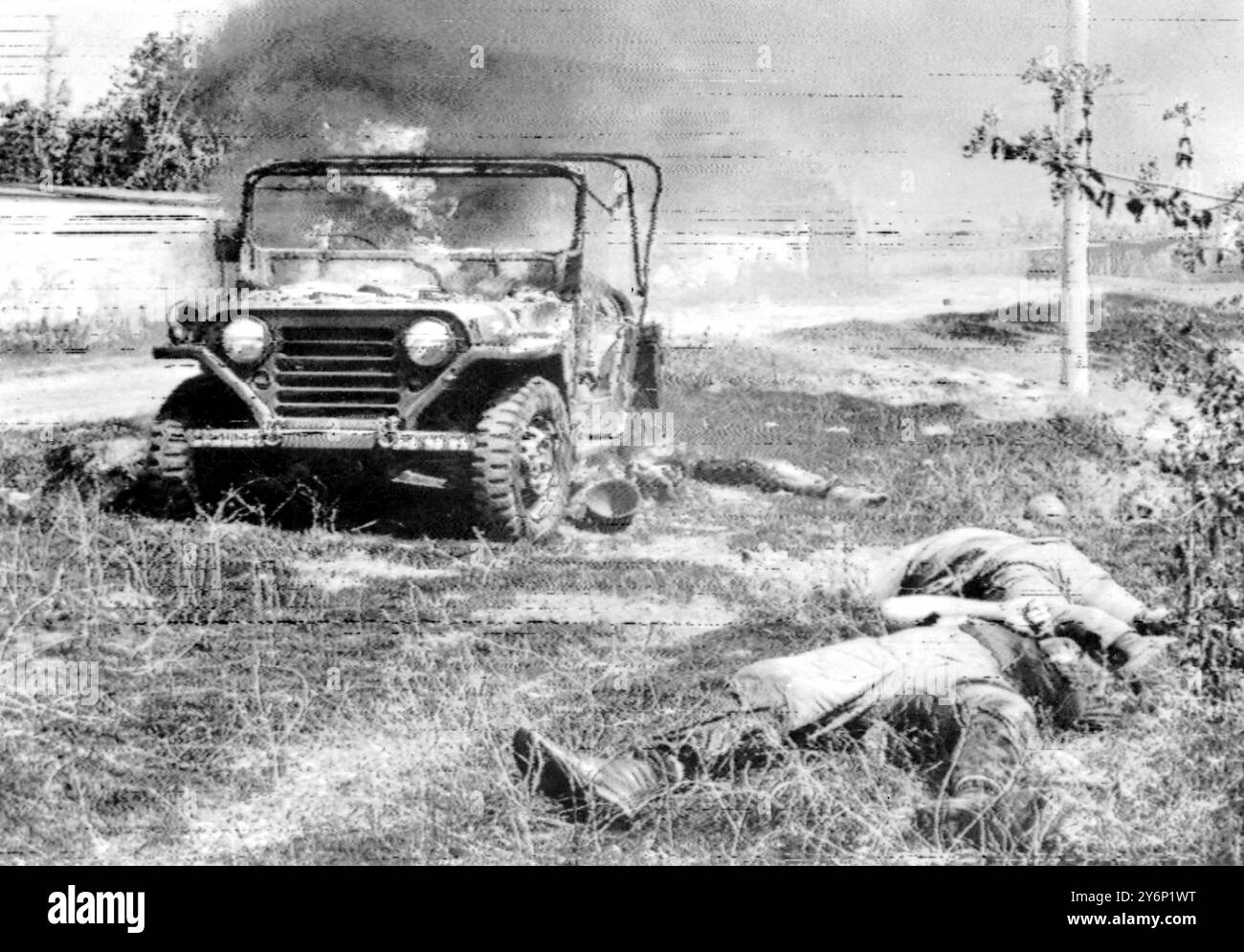 Bodies of two American soldiers lay in foreground of their jeep after ...