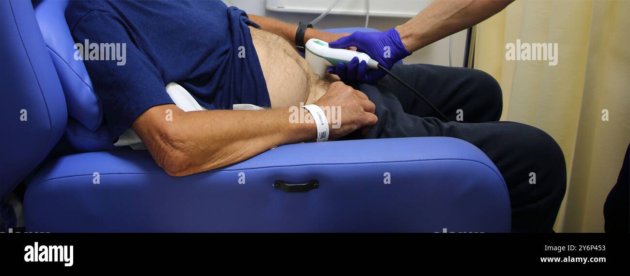 Nurse Using a Bladder Scanner to Calculate the Volume in a Patient's ...