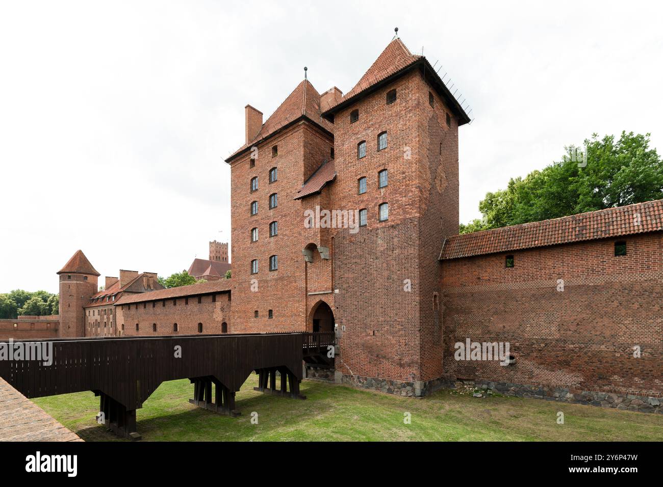 Wood bridge leading to medieval castle entrance gate Stock Photo - Alamy