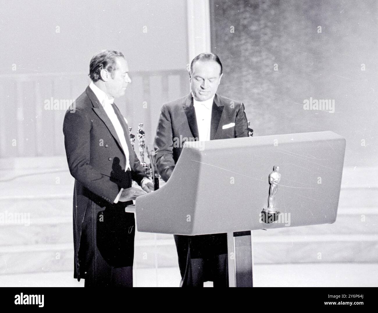 Shaking hands during 37 Annual Academy Awards Bob Hope and Rex Harrison ...