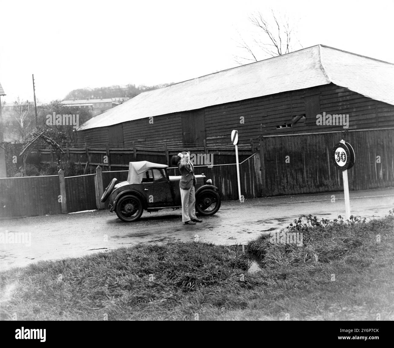 Early example of ambiguous road signs Stock Photo - Alamy