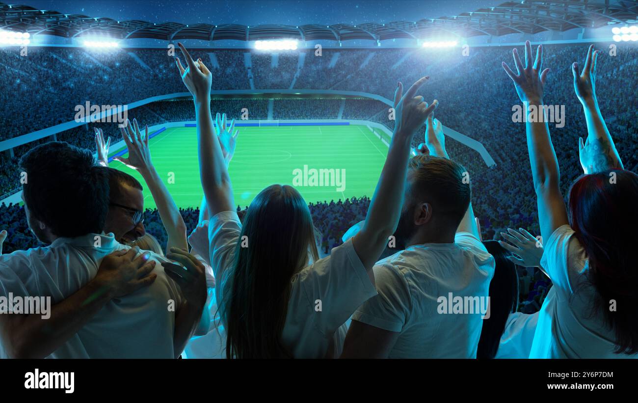 Fans in white shirts celebrating and pointing fingers toward soccer ...