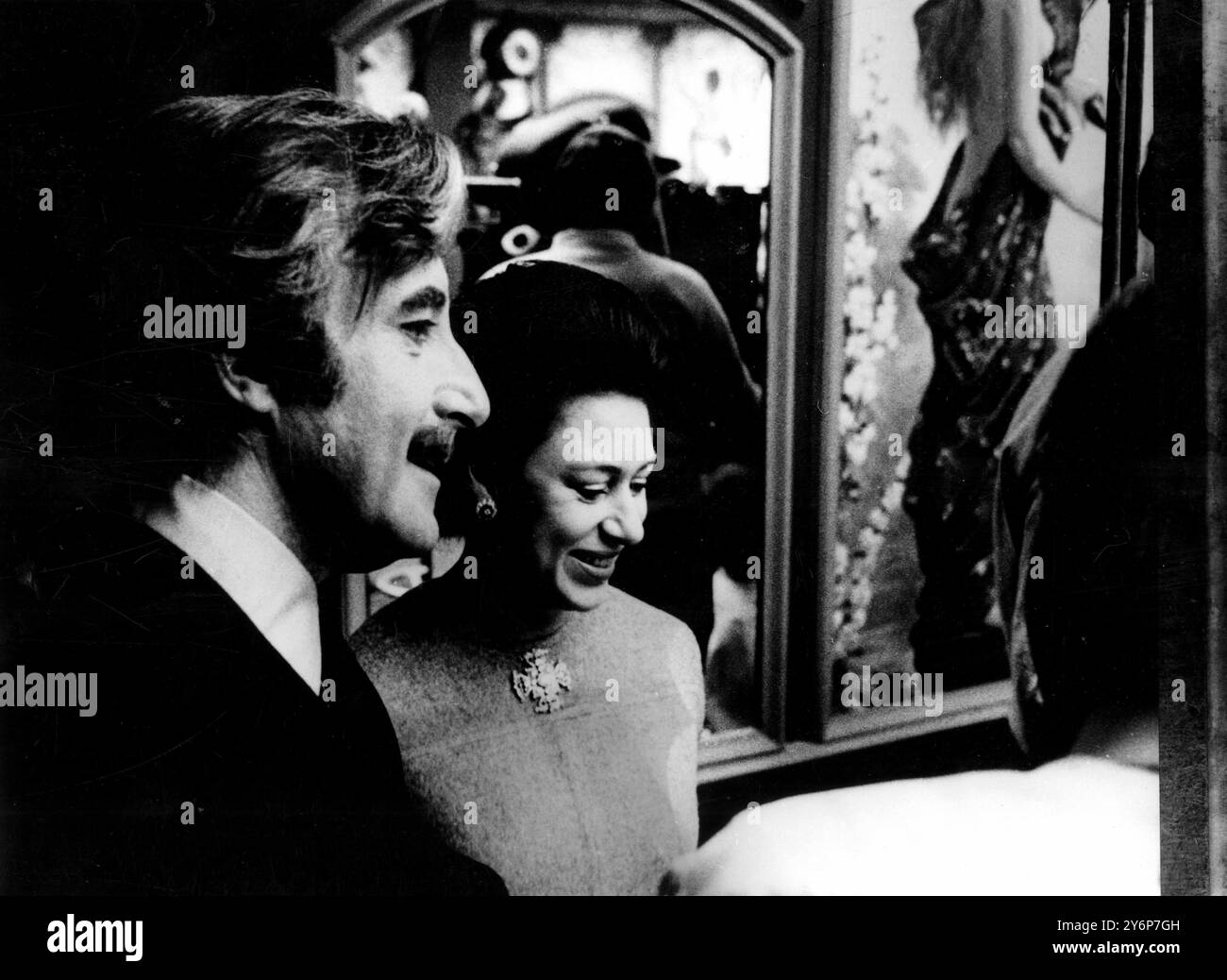 Princess Margaret, a surprise visitor, talks with Peter Sellers on the ...