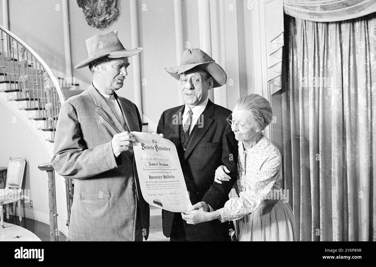 Buddy Ebsen (Jed Clampett) presenting Robert Briscoe with a scroll ...