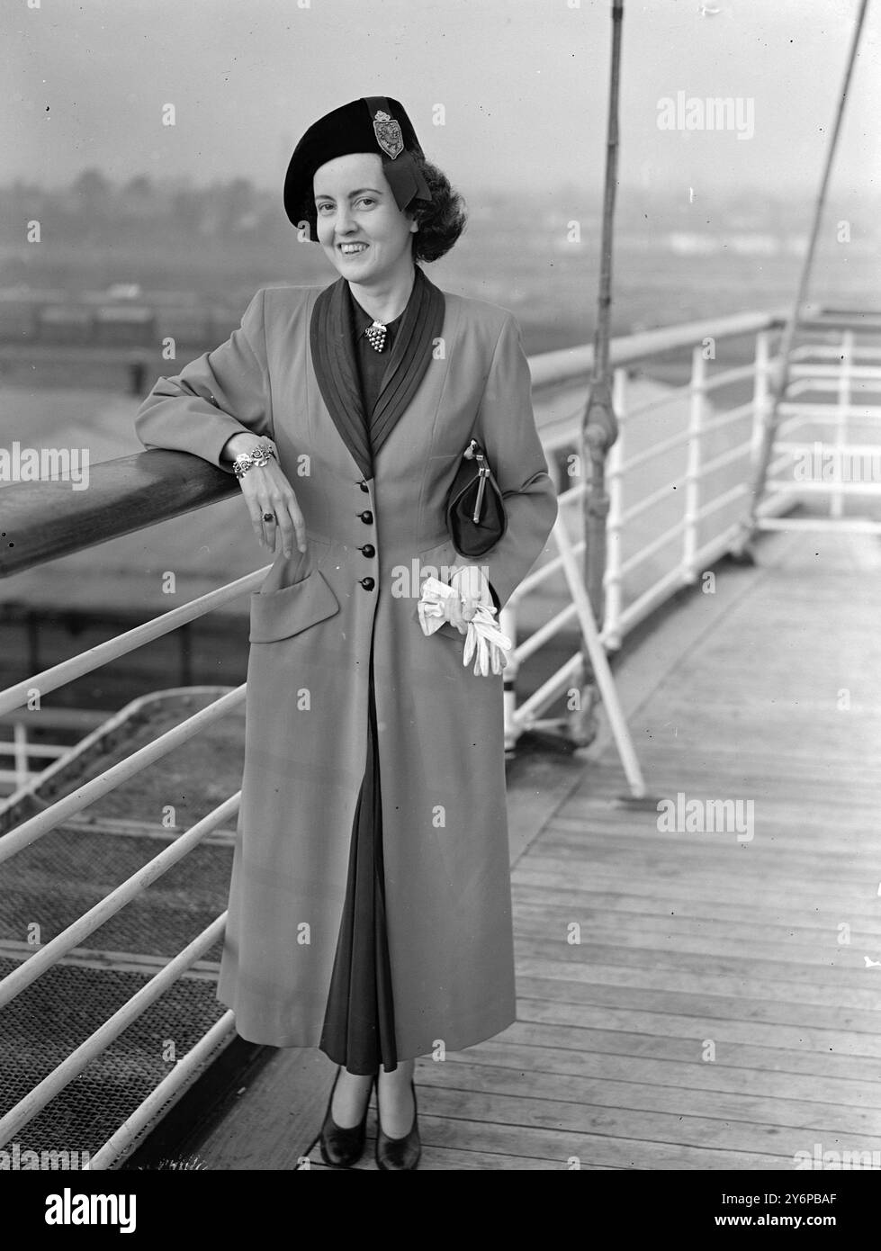 '' WAVE '' IN CIVVIES . Arriving in civilian clothes at Southampton is ...