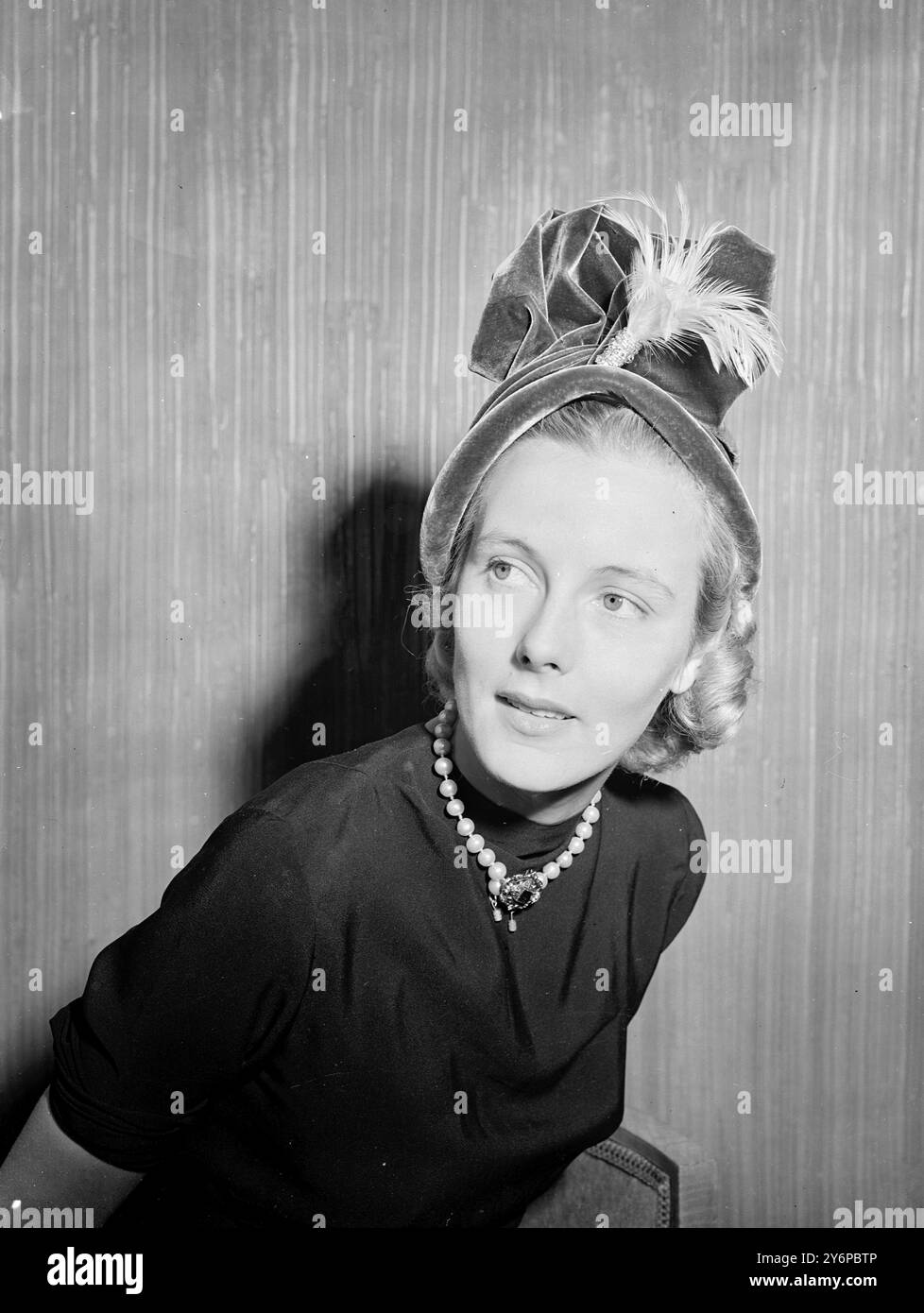 TREND TOWARD HEIGHT A high Crown of the hat worn by the model in this ...