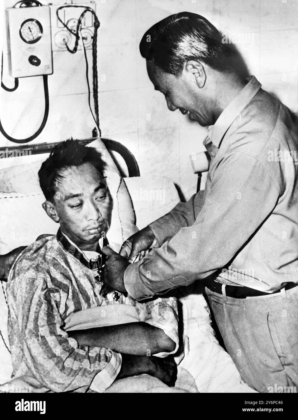 South Vietnam's President Nguyen Van Thieu , hangs a Vietnamese Medal of Honour on wounded ...