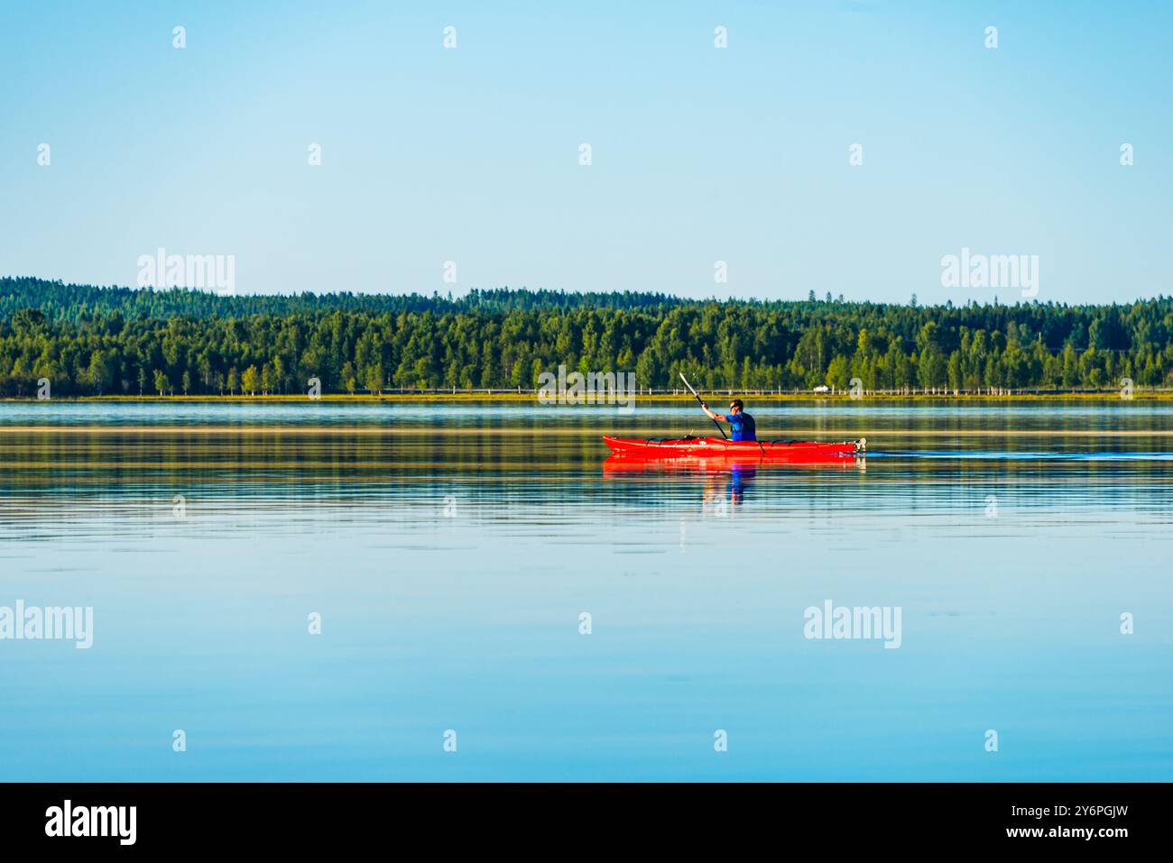 Surrounded by calm waters lush greenery under clear sky hi-res stock ...