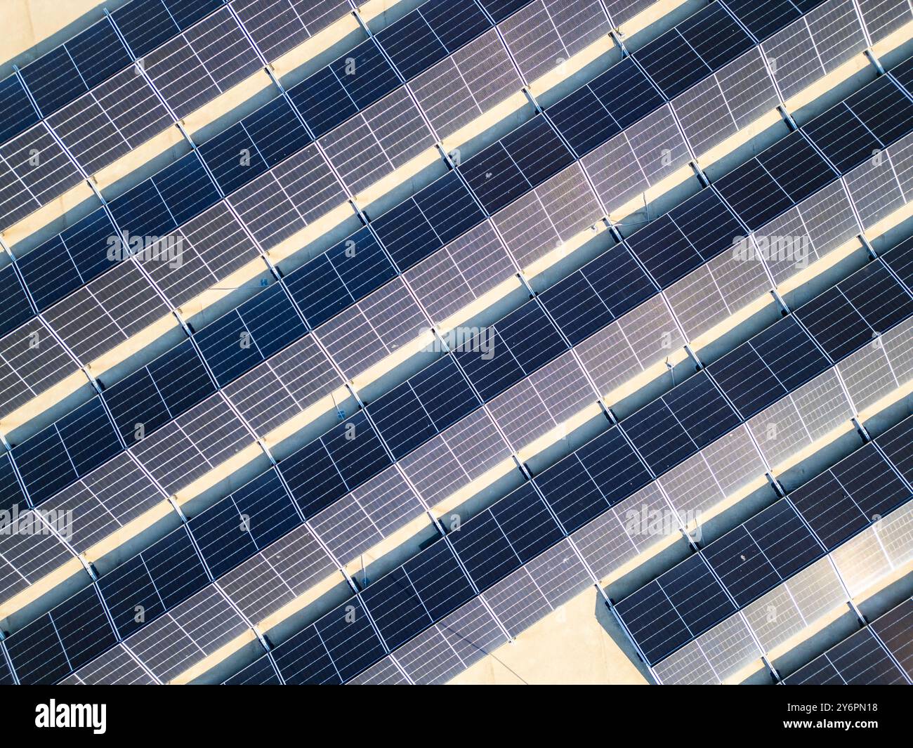 Aerial view of a large solar panel installation on a commercial rooftop ...