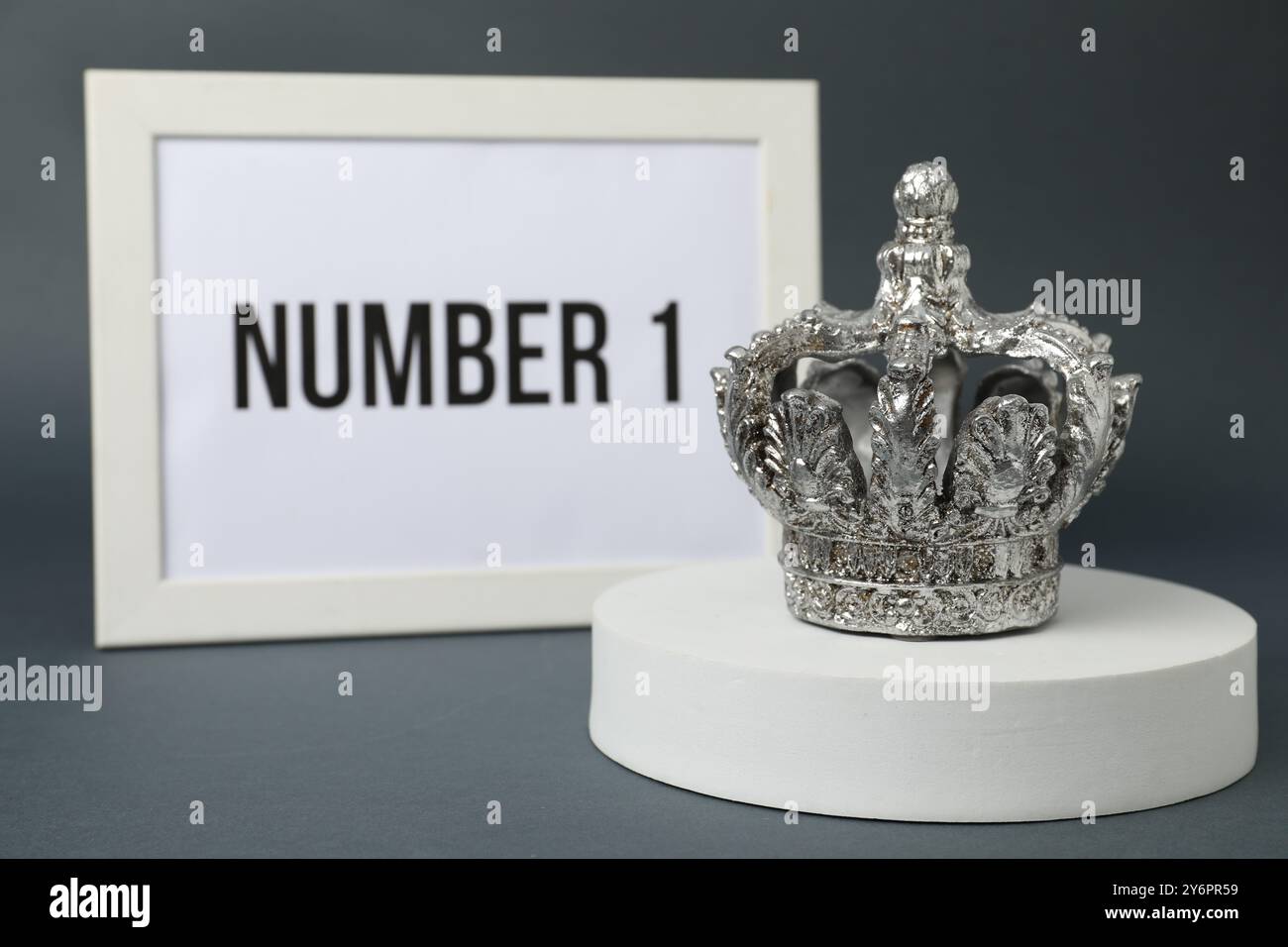 Frame with phrase Number 1 and silver crown on grey background Stock ...