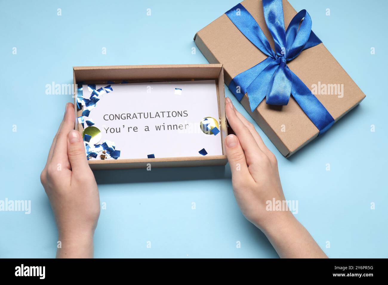 Woman opening gift box with phrase Congratulations You`re Winner on ...