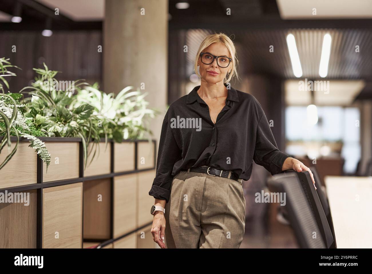 A Confident and Professional Individual Working in a Modern and Stylish ...