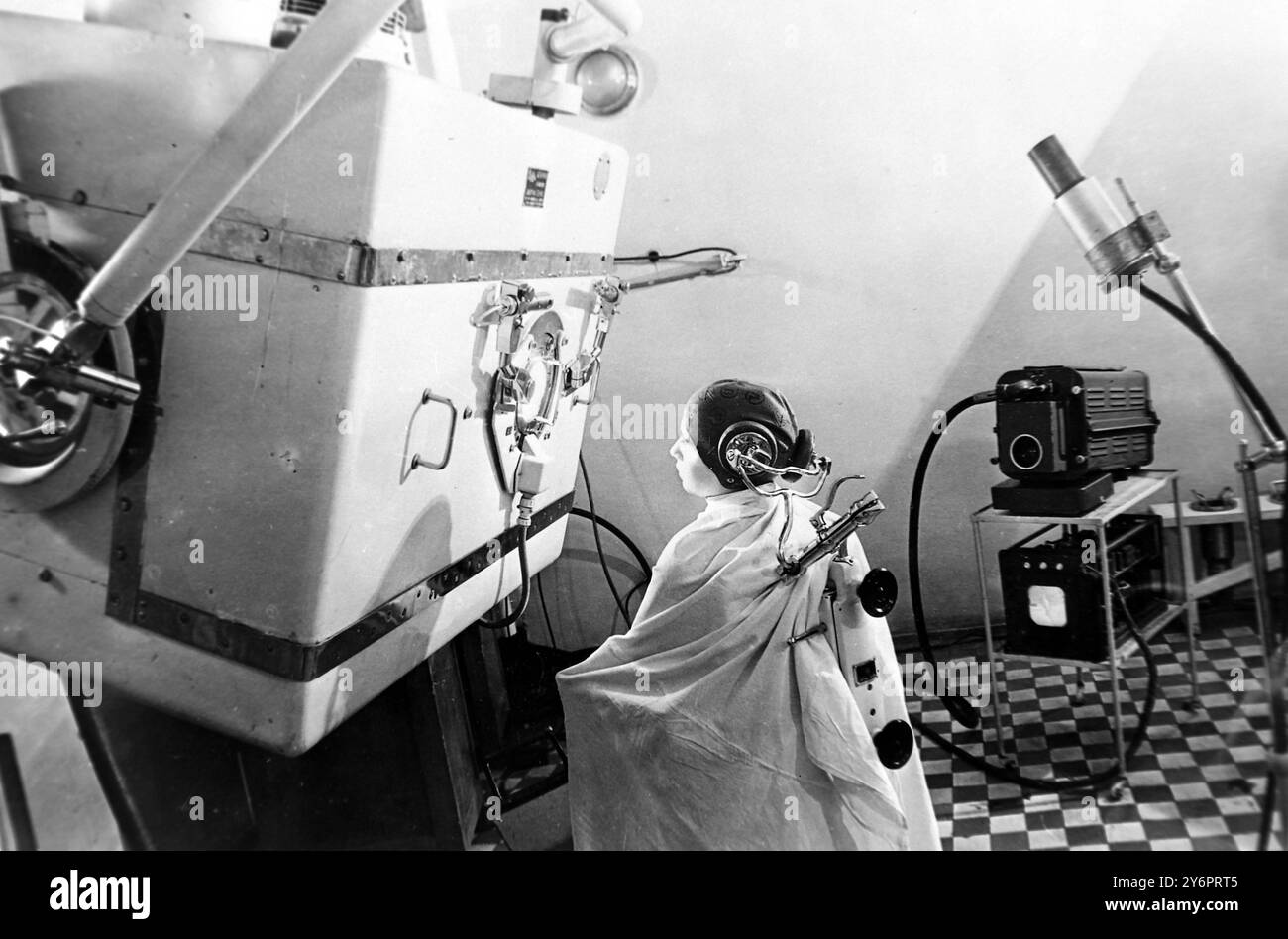 25 JULY 1962 A PATIENT IN THE TREATMENT HALL OF THE BETATRON WHICH IS ...