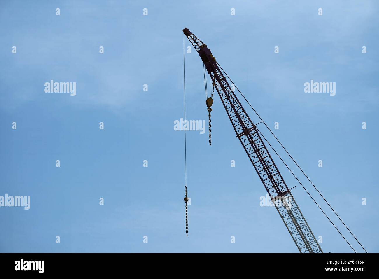 A prominent vessel is undergoing elevation by a crane at Alang Shipyard ...