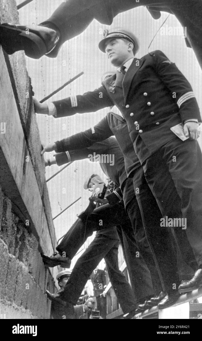 BORDER FRENCH SAILORS LOOKING OVER COMMUNIST BUILT WALL BERLIN ; 30 MAY ...
