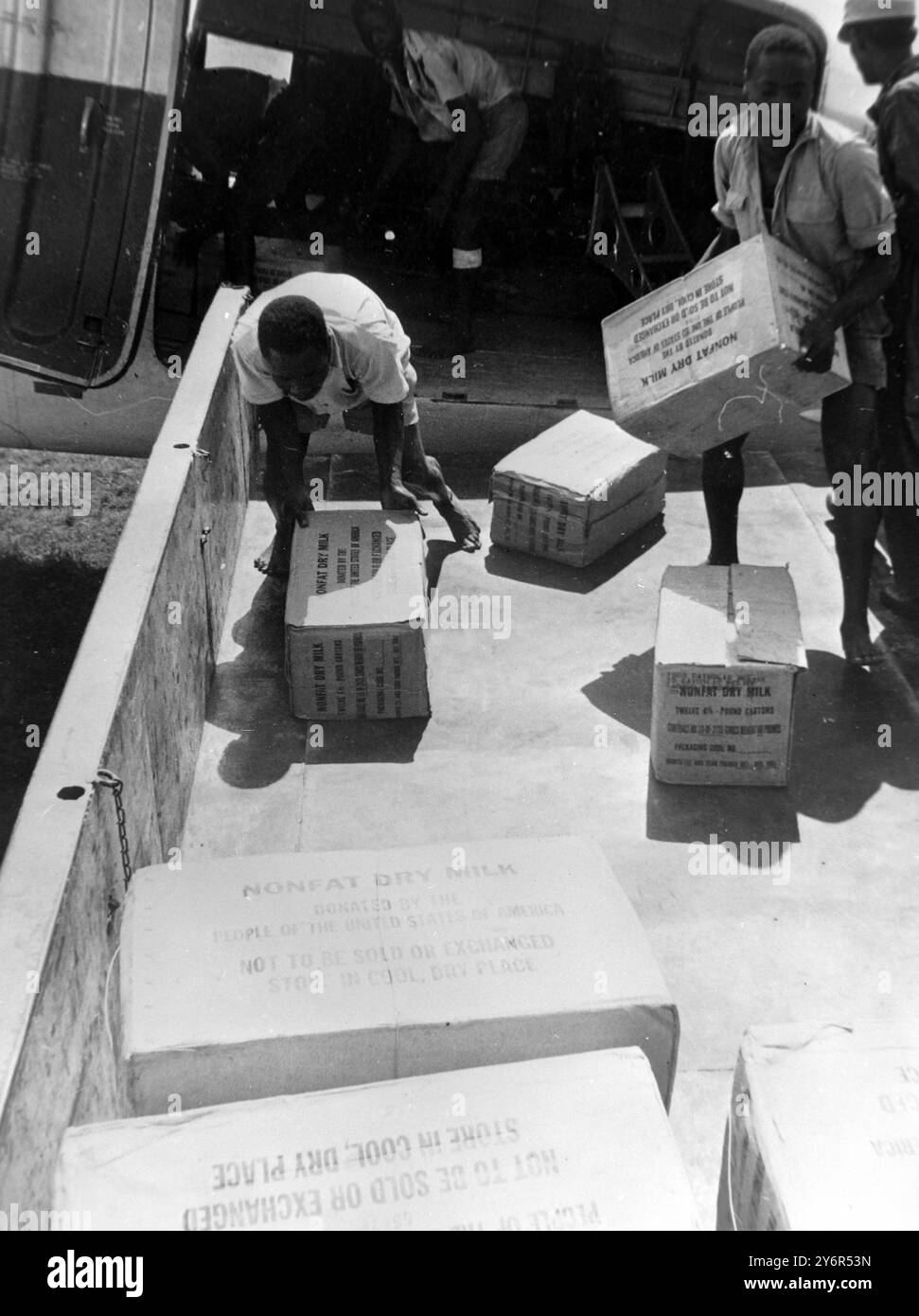 POLICE POLICE UNLOADING POWDERED MILK KIVU ; 23 MAY 1962 Stock Photo ...