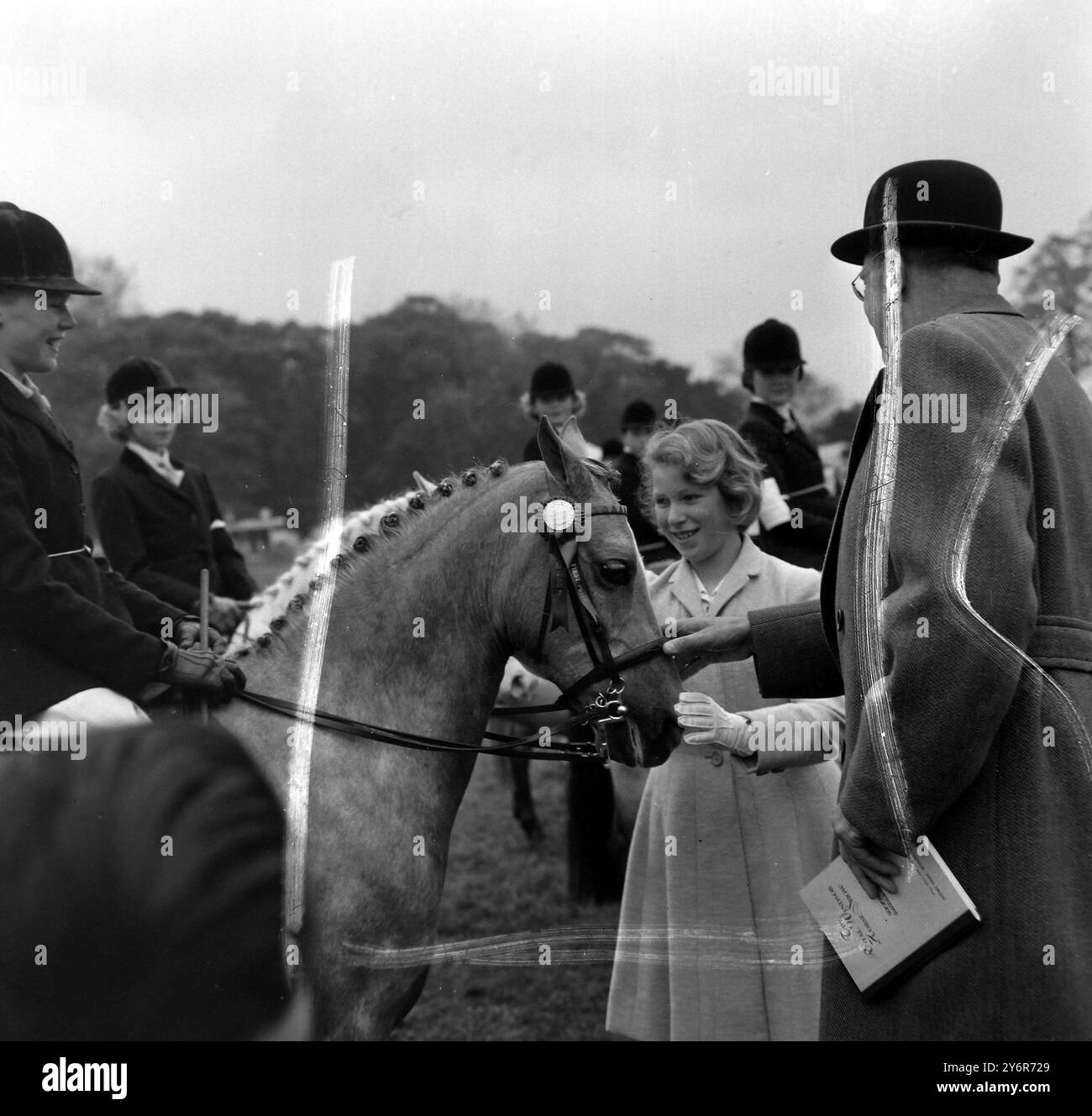 HORSE SHOWS PRINCESS ANNE PATS PONY PRESENTED ROSETTE ROYAL WINDSO ; 12 MAY 1962 Stock Photo - Alamy