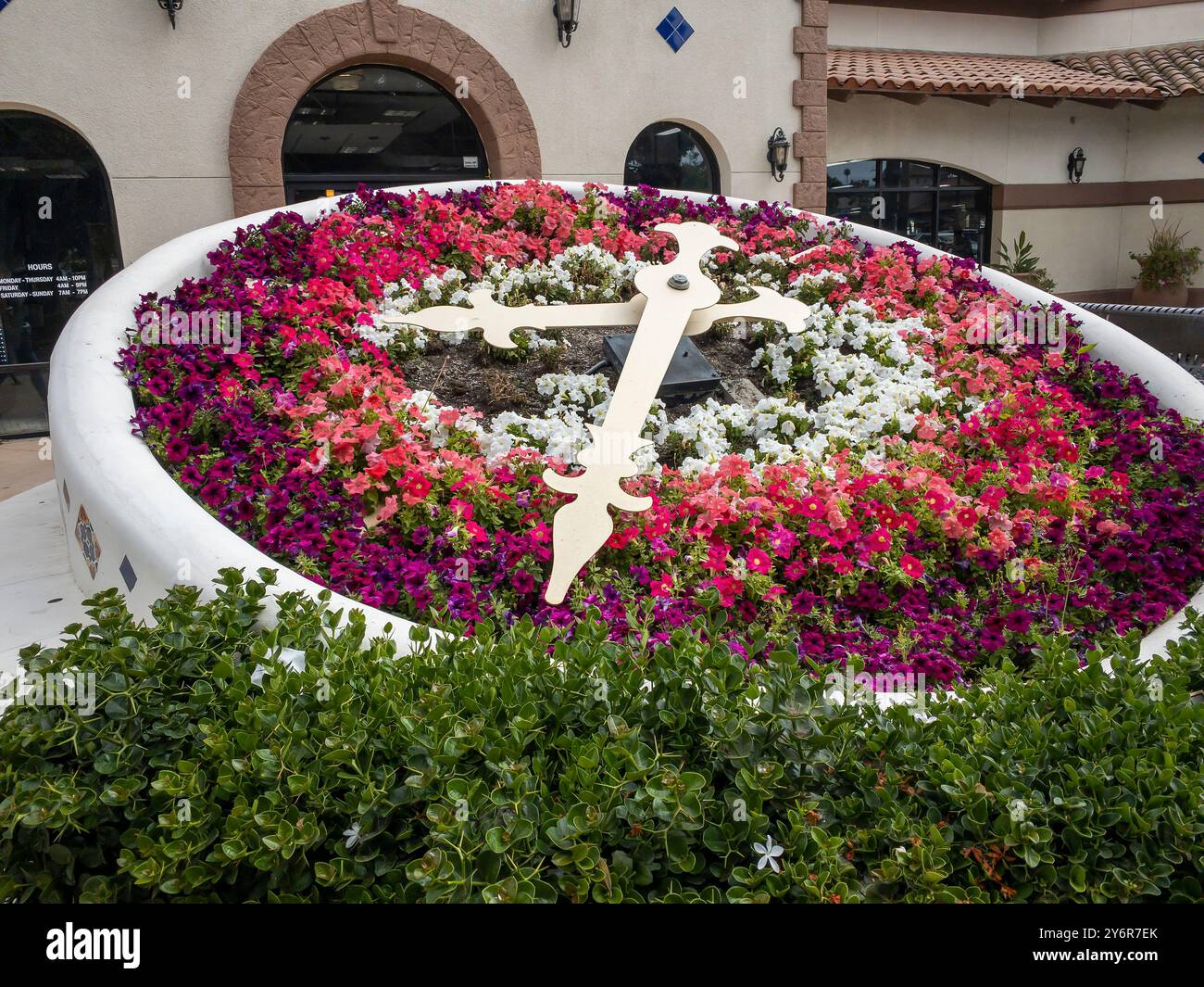 Large clock built around a floral landscape Stock Photo - Alamy