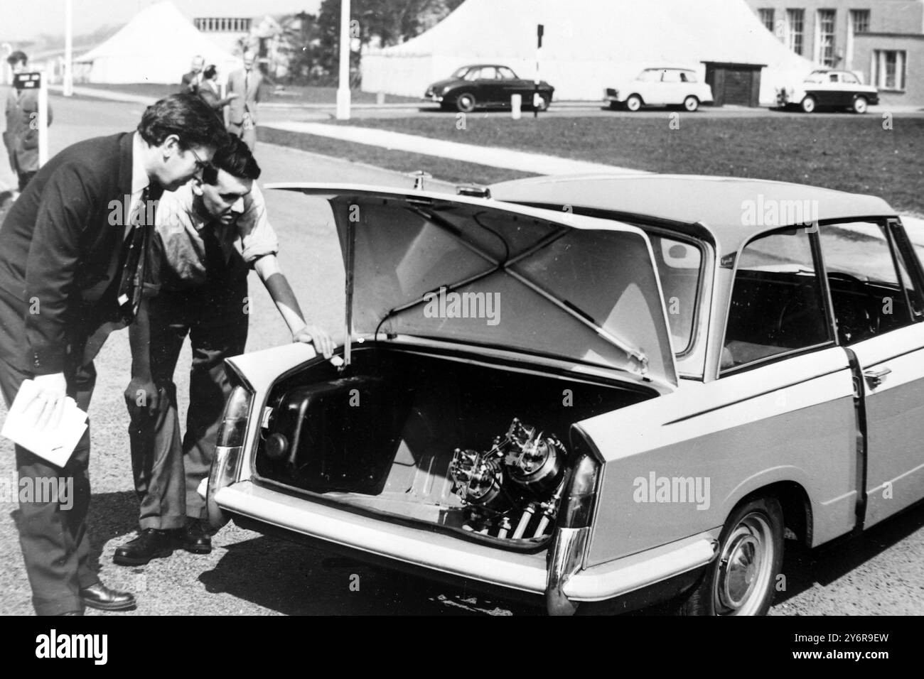 ROGER HANCOCK WITH DONALD FITH LOOK AT CAR TRIUMPH HERALD BOOT / ; 2 ...