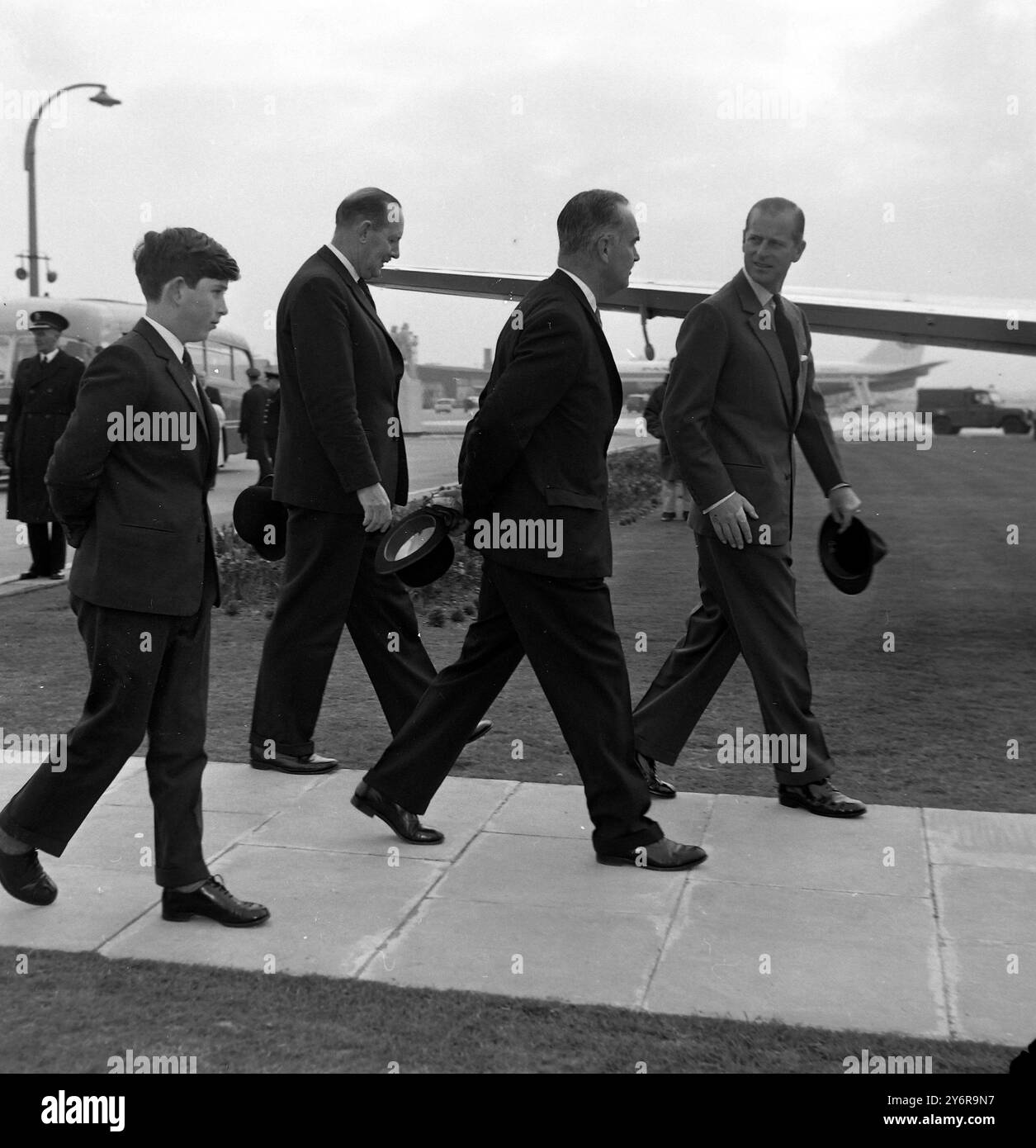 PRINCE CHARLES AT LONDON AIRPORT ON THE WAY TO BOARD AIRCRAFT ; 1 MAY ...