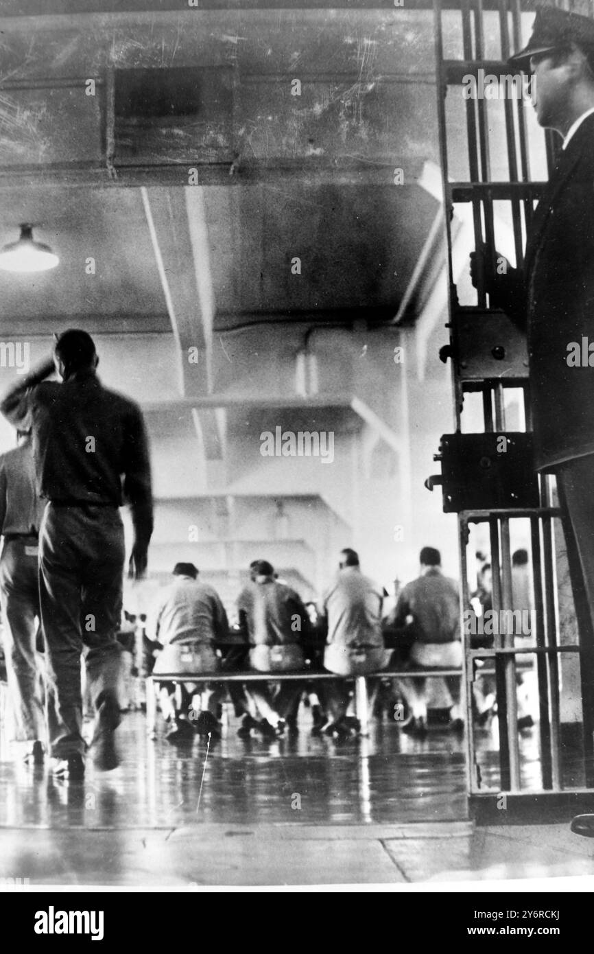 ALCATRAZ PRISON GUARD STANDS BY PRISONERS ENTERING MESS ROOM SAN ...