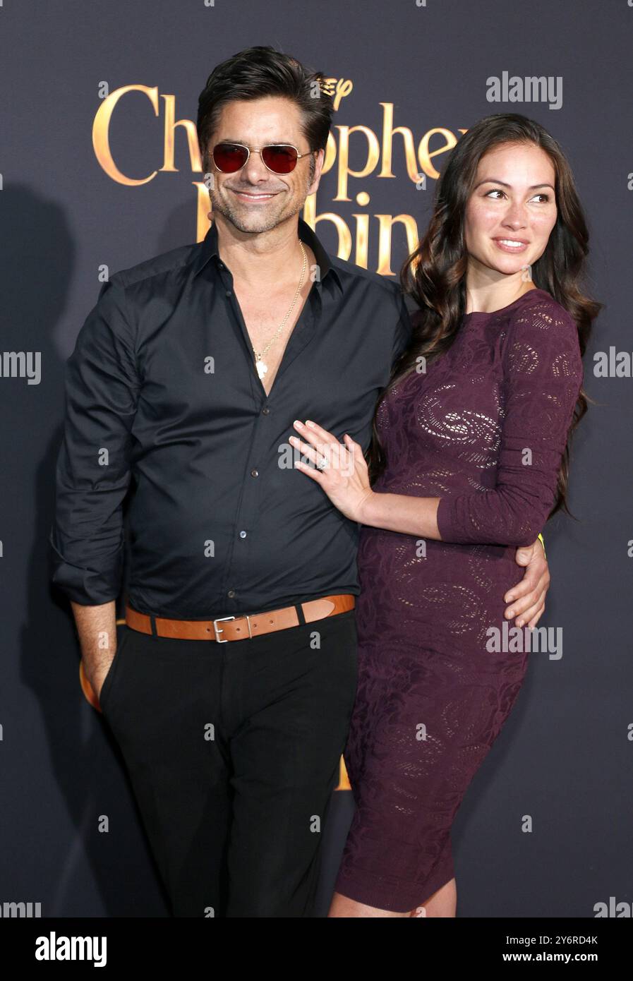 John Stamos and Caitlin McHugh at the Los Angeles premiere of 'Christopher Robin' held at the ...