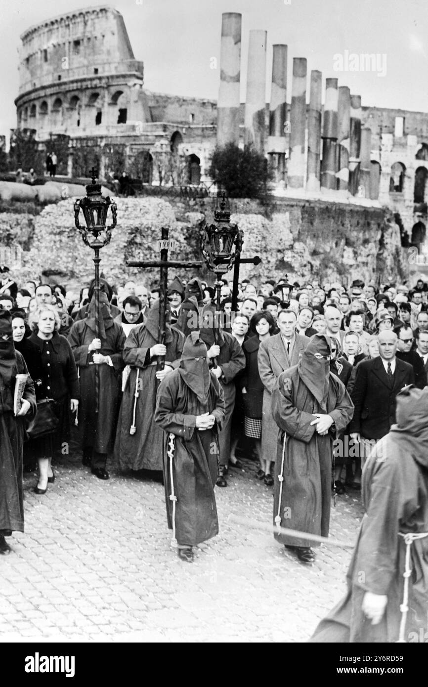 RELIGION - HOODED MEN CARRYING CROSS DURING EASTER PILGRIMAGE IN ROME ...