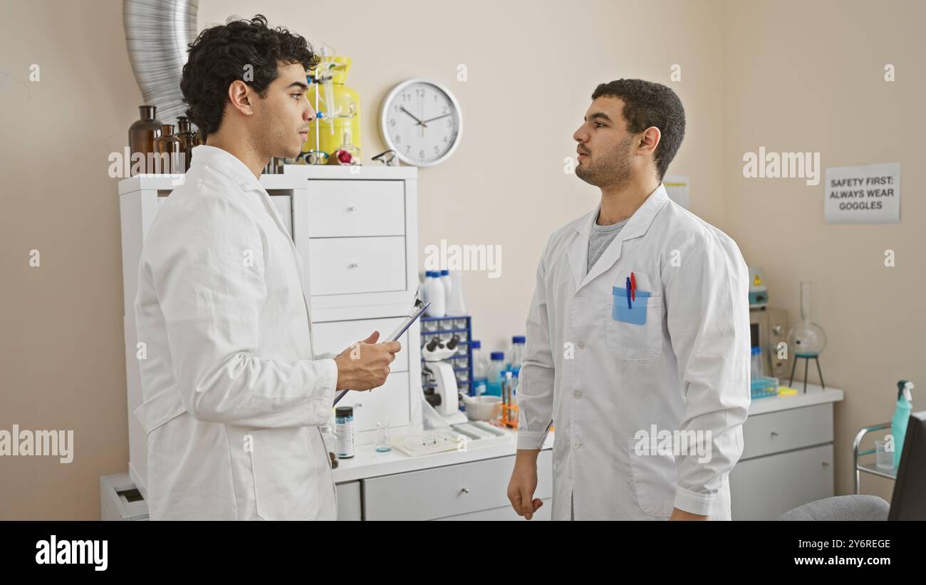 Team scientists conversation in laboratory hi-res stock photography and ...