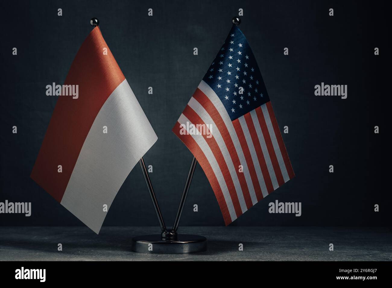Table flag of United States America and Indonesia on dark background ...