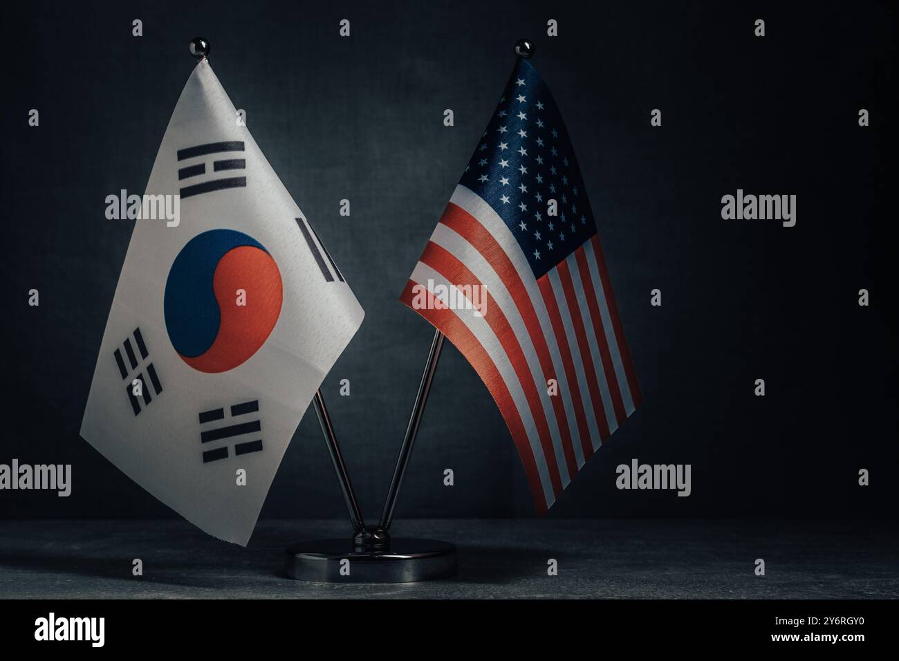 Table flag of United States America and South Korea on dark background ...