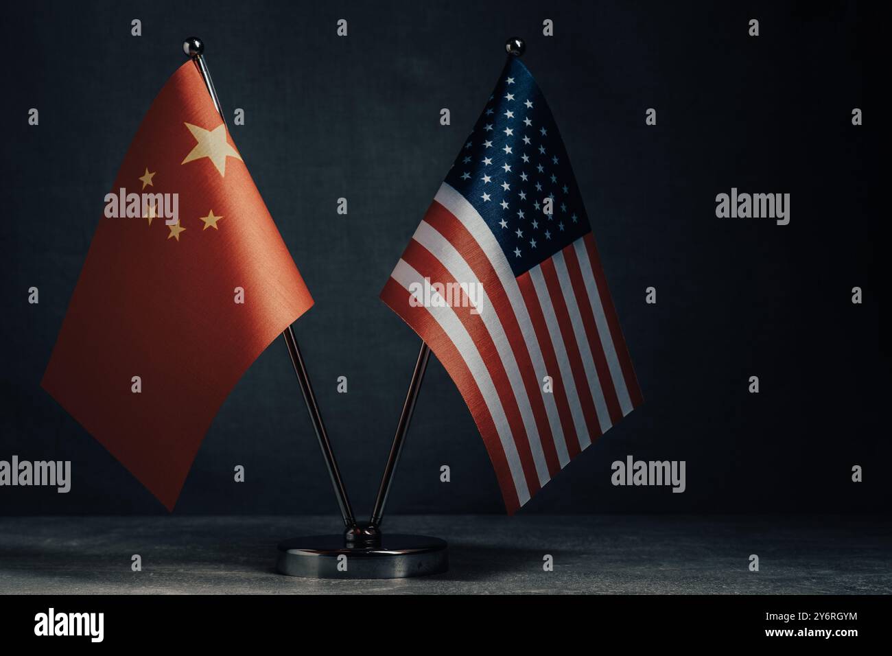 Table flag of United States America and China on dark background ...