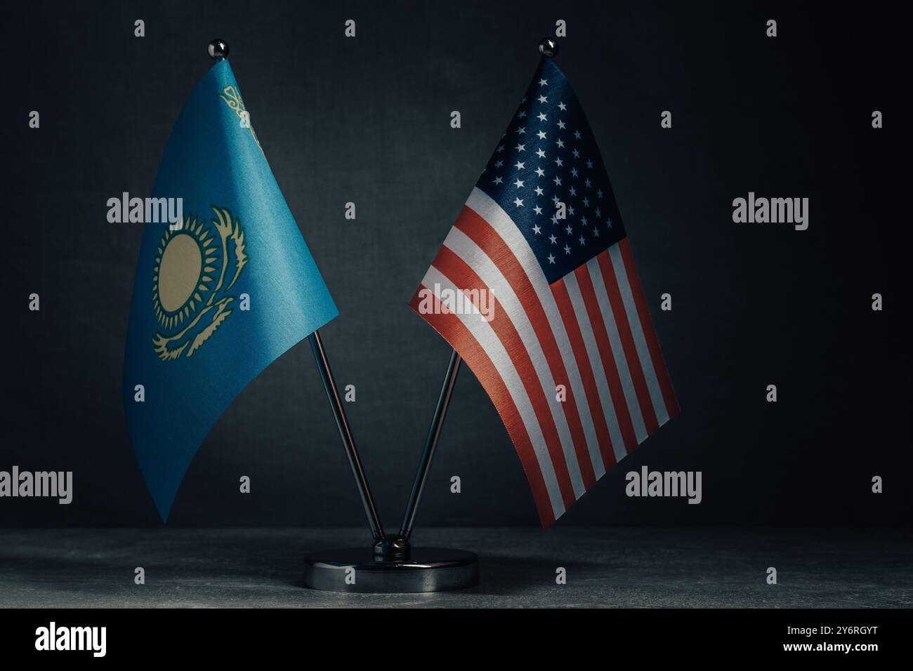 Table flag of United States America and Kazakhstan on dark background ...