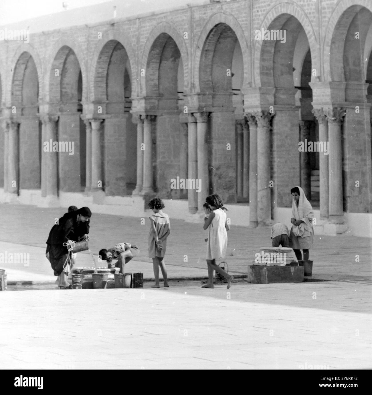 NATIVES DRAWING WATER FROM WELL IN TUNIS 12 MARCH 1962 Stock Photo - Alamy