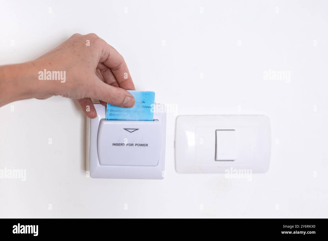 Woman using electronic key card in hotel room. Contactless card for ...