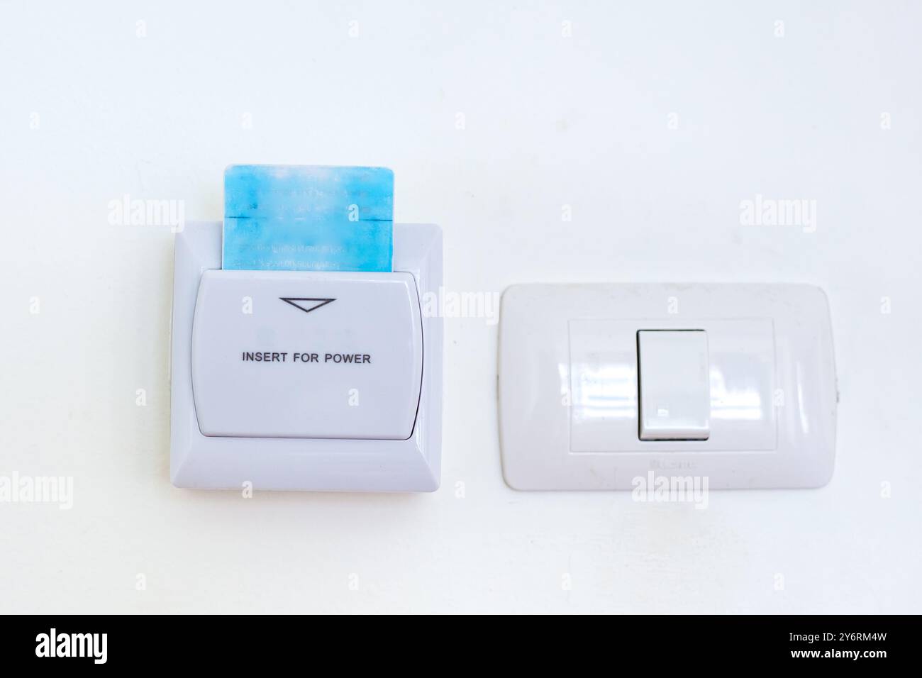 Using an electronic key card in a hotel room. Contactless card for ...