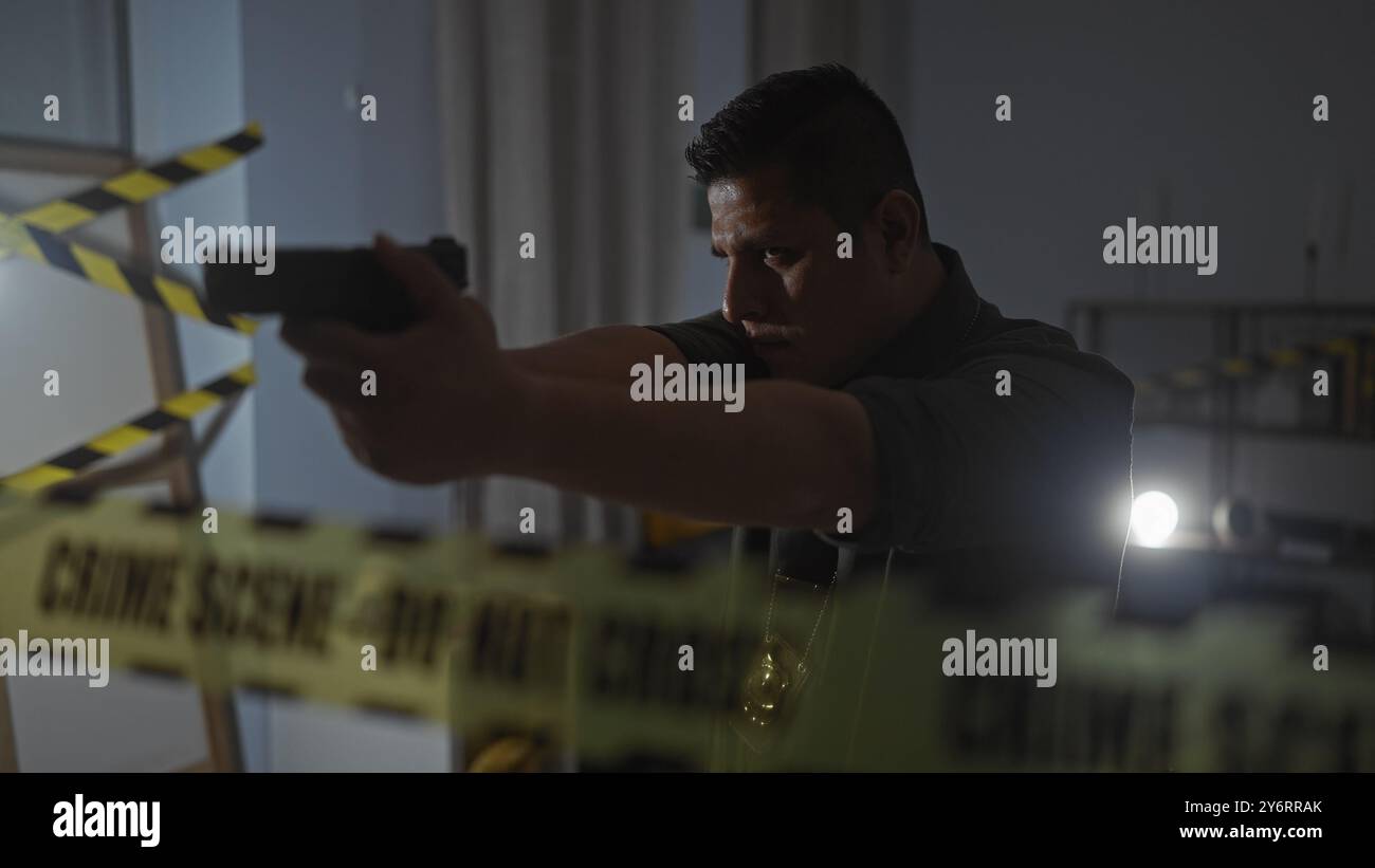 Hispanic man aiming gun in dimly lit crime scene with yellow tape and ...