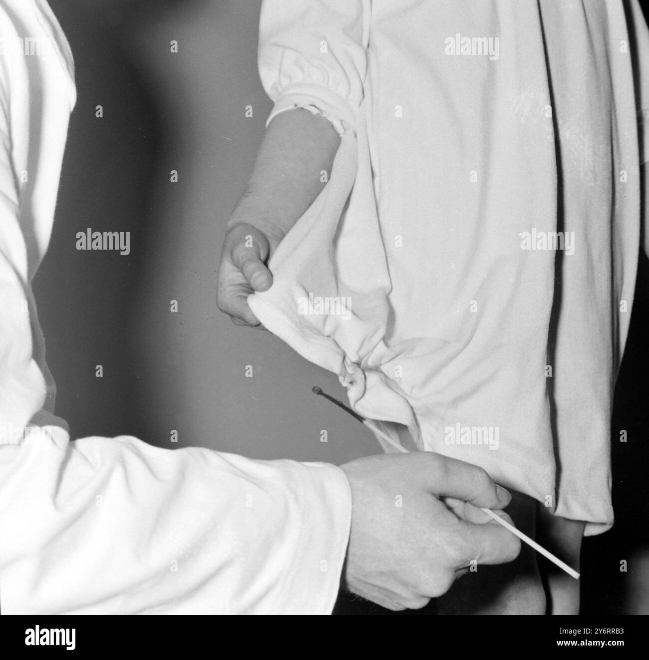 DAVIES GORDON TEST FIREPROOF NIGHTGOWN / 21 FEBRUARY 1962 Stock Photo ...