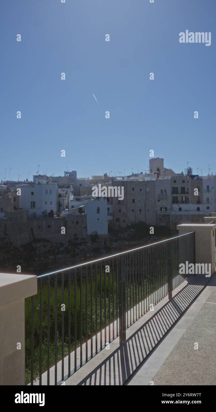 Scenic view of polignano a mare's historic cliffside buildings under a ...