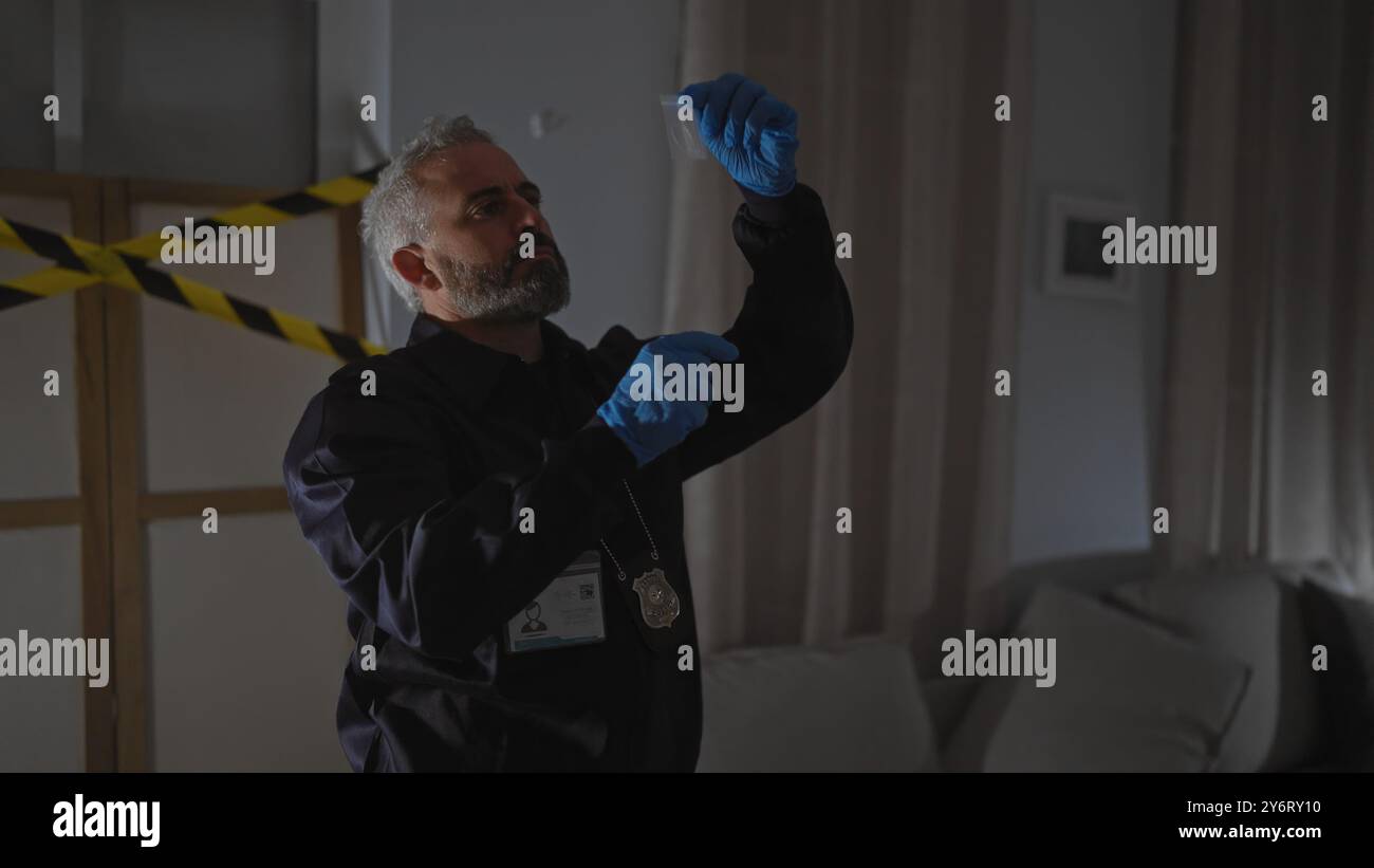 Investigator analyzes evidence in a dimly lit crime scene room marked ...