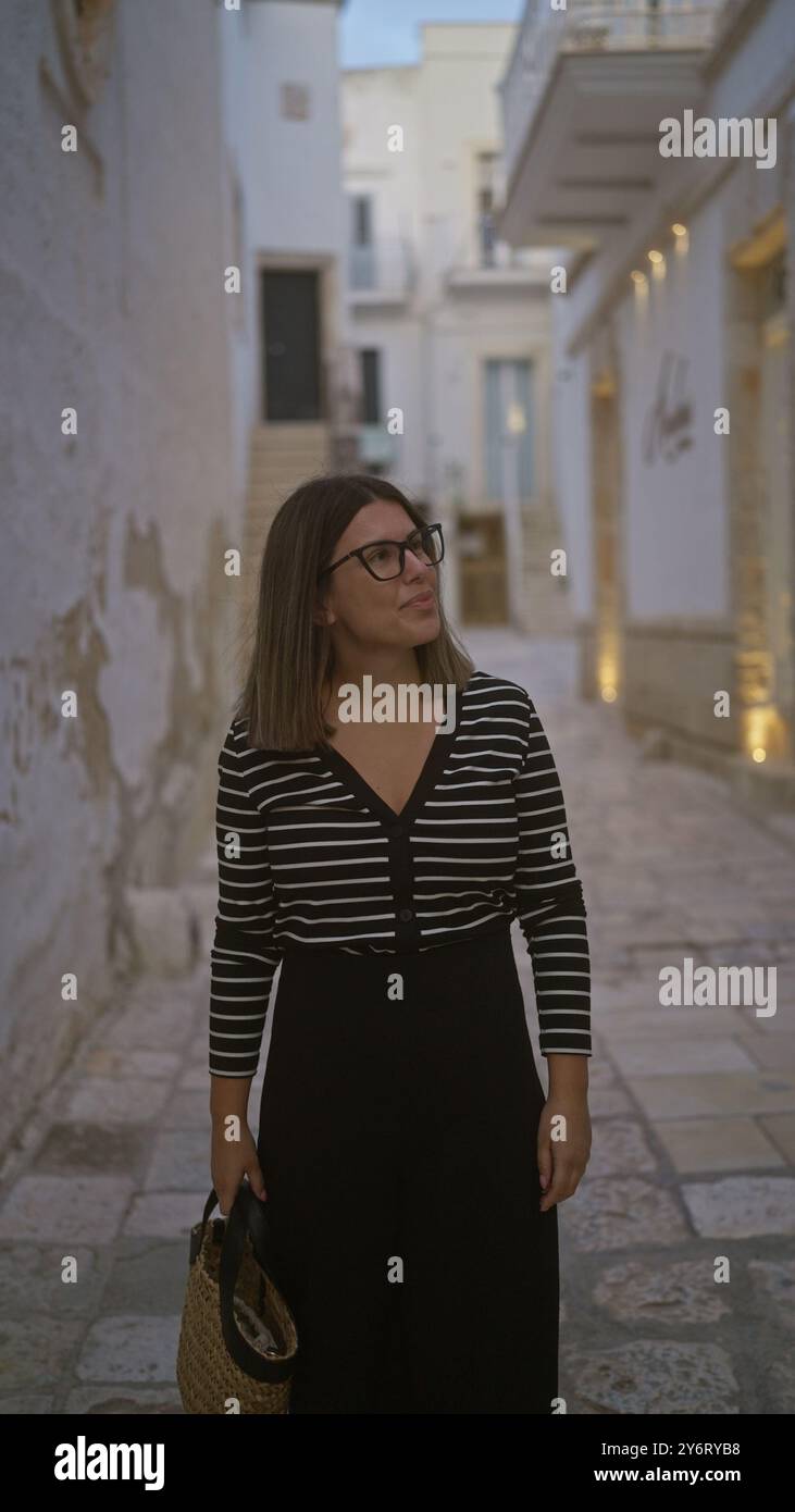 A young, beautiful hispanic woman explores the charming, historic ...