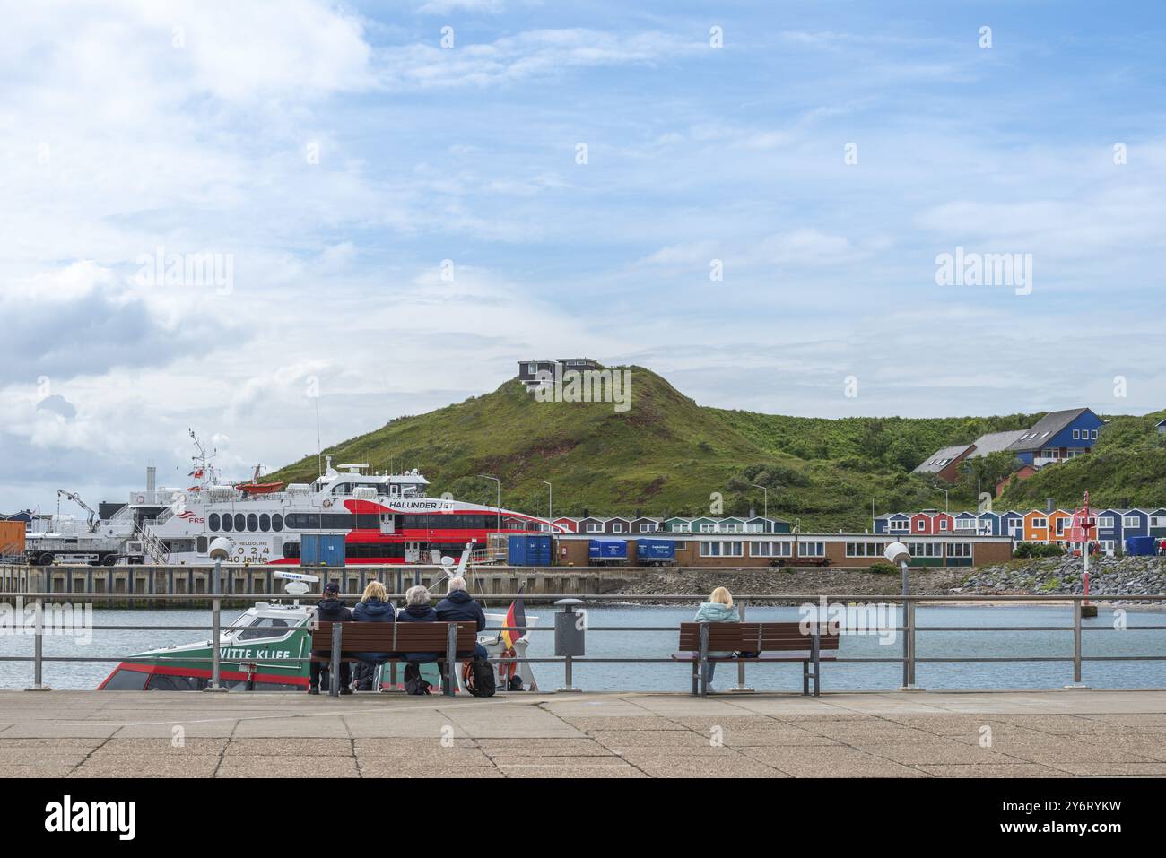 View over the jetty to the high-speed catamaran Halunder Jet, colourful ...