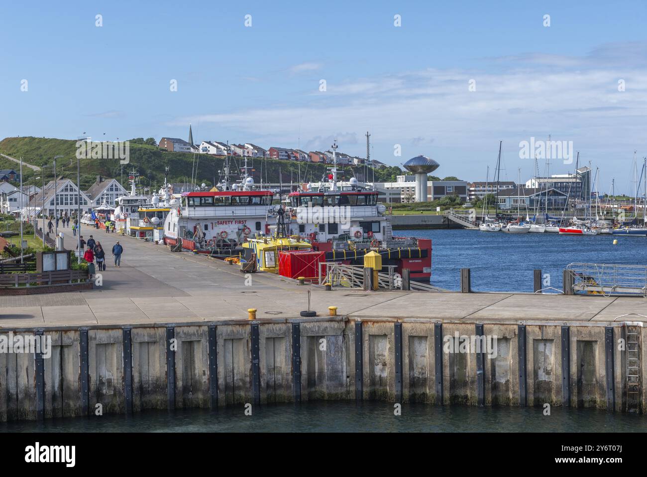 Inland harbour with sailing yachts and offshore supply vessels ...