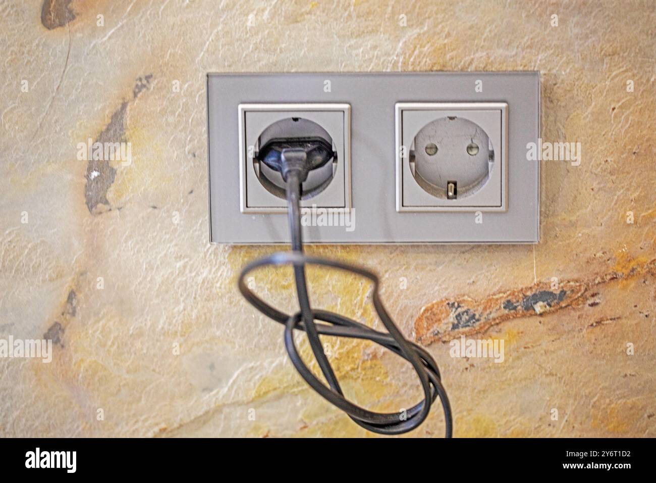 modern sockets in the interior on a concrete wall Stock Photo - Alamy