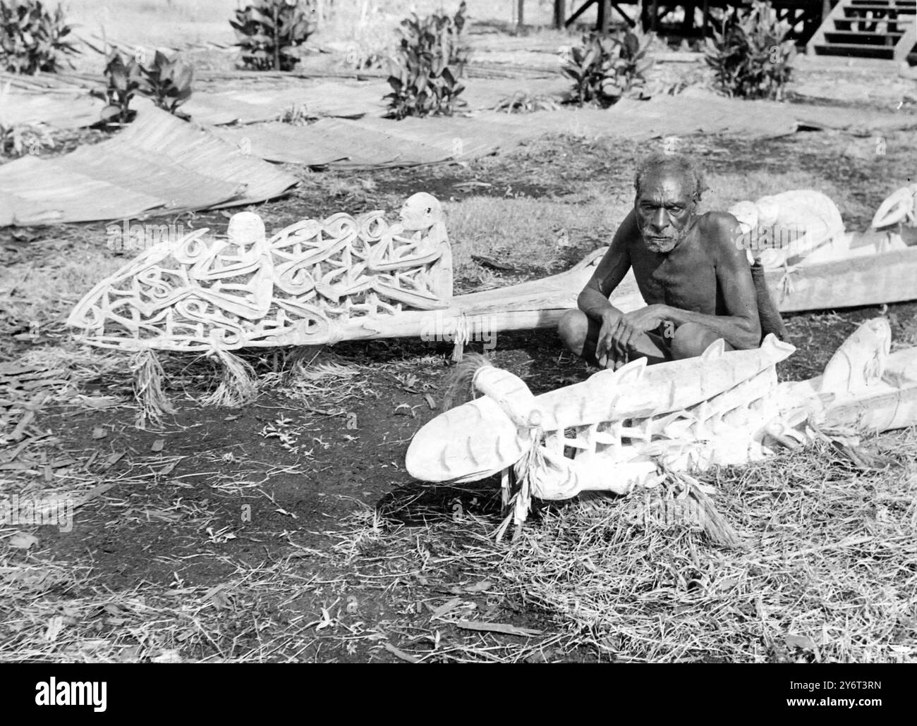 ARTISANS NATIVE ARTISAN EXAMINES BOW OF DEAD MANS PROA IN NEW GUINEA 17 ...