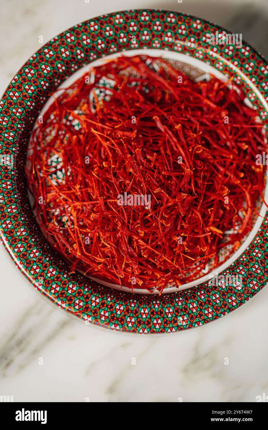 middle eastern container full of red saffron threads Stock Photo - Alamy
