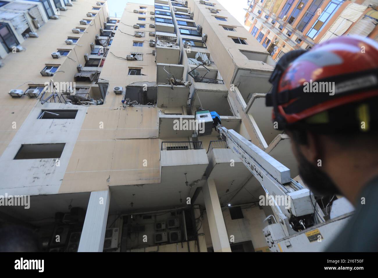 Beirut, Lebanon. 26th Sep, 2024. Rescuers work at the site of an ...