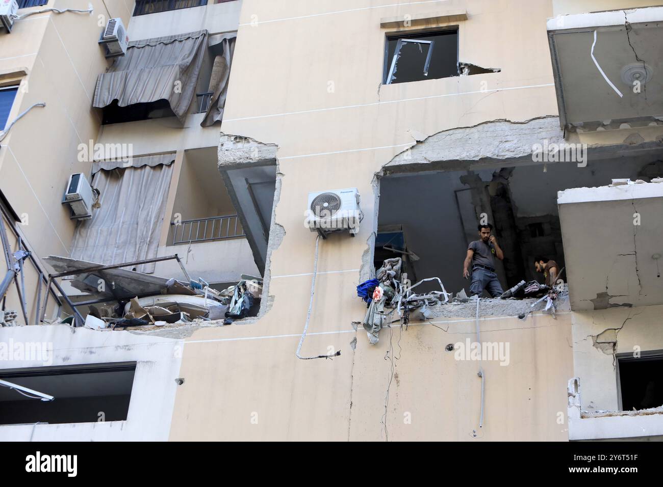 Beirut, Lebanon. 26th Sep, 2024. People are seen in a building after an ...